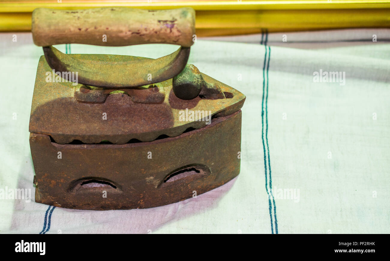 Retro metallized heavy antique iron tool for ironing Stock Photo - Alamy