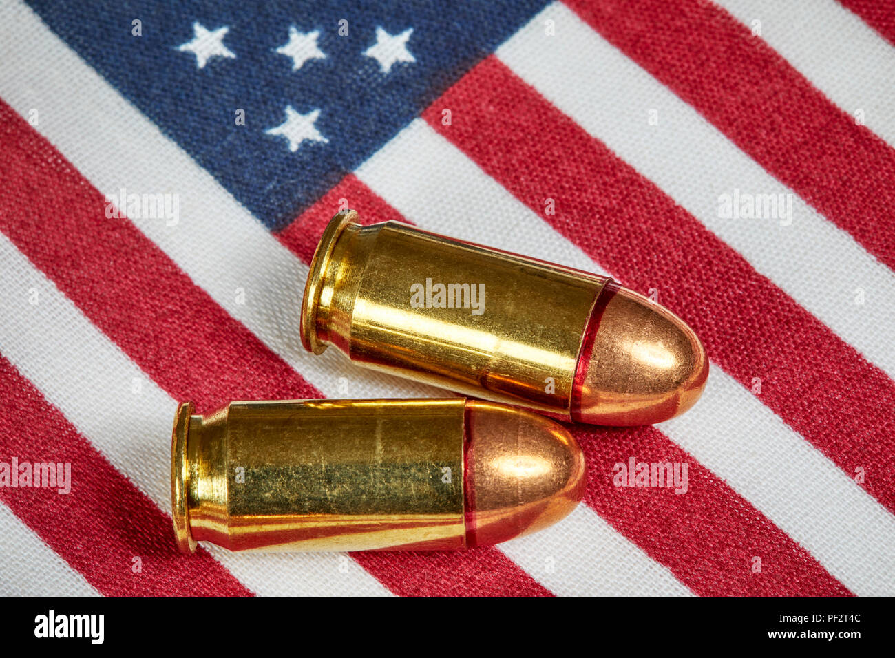 Two .45 caliber bullets on an American Flag Stock Photo - Alamy