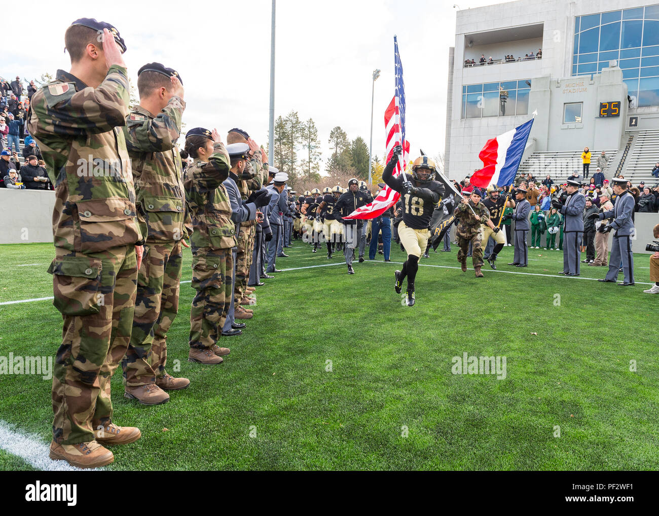 French Cadets render hand salutes as the Army West Point Football team ...