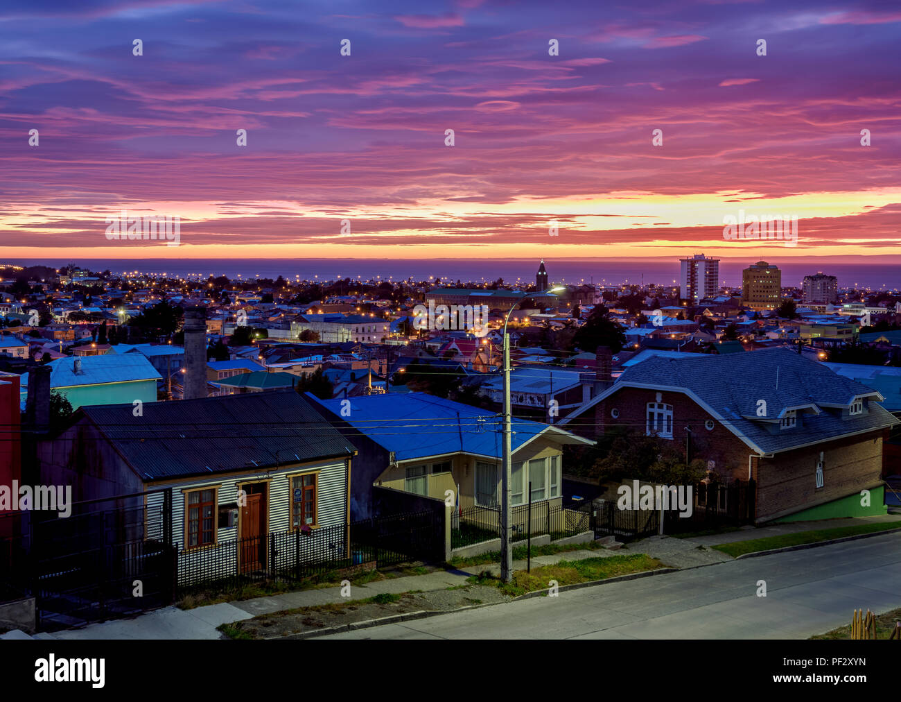 View over city towards Strait of Magellan at sunrise, Punta Arenas ...