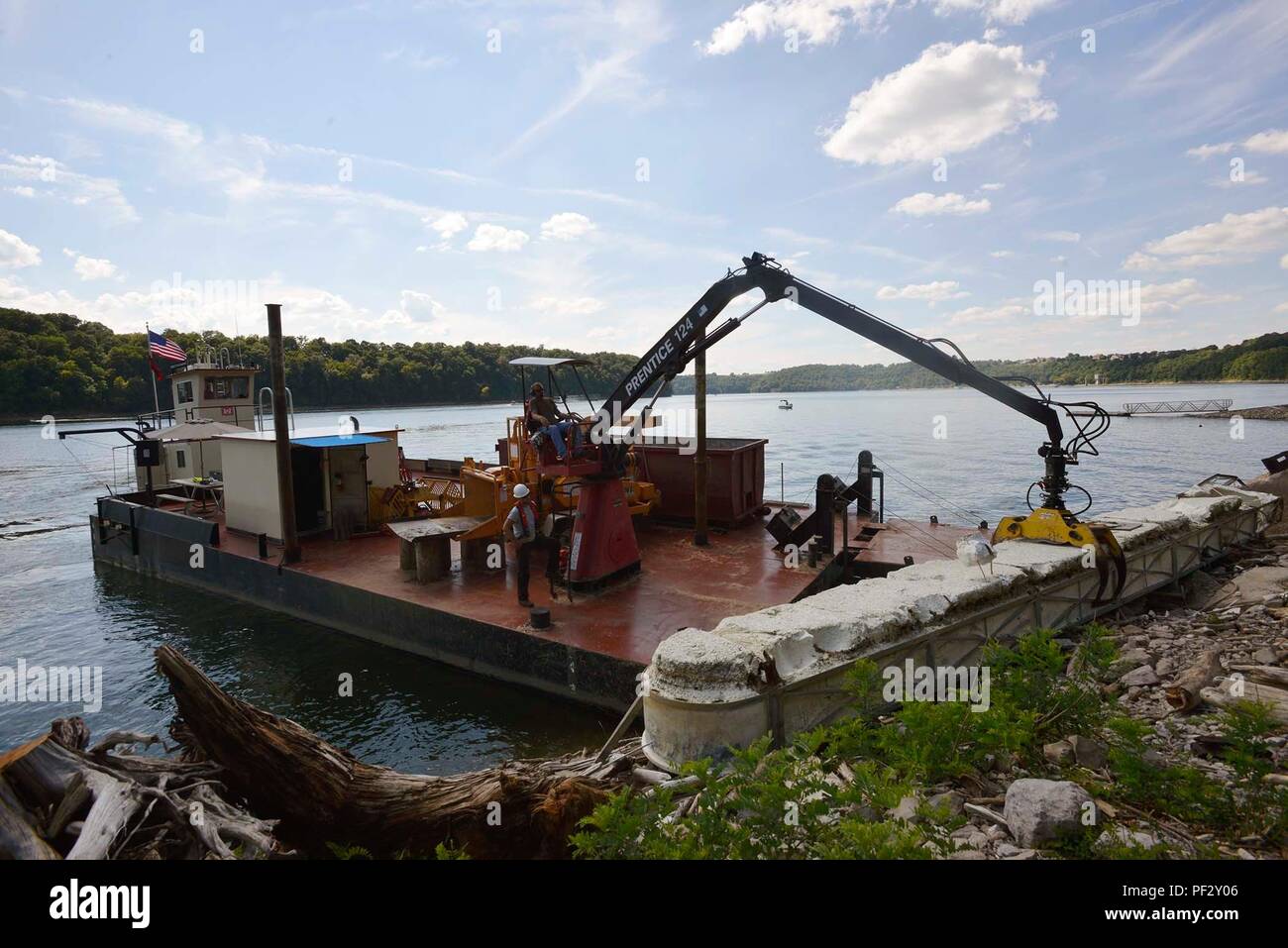 Daniel Peyton, operates a mechanical knuckle boom material handler and ...