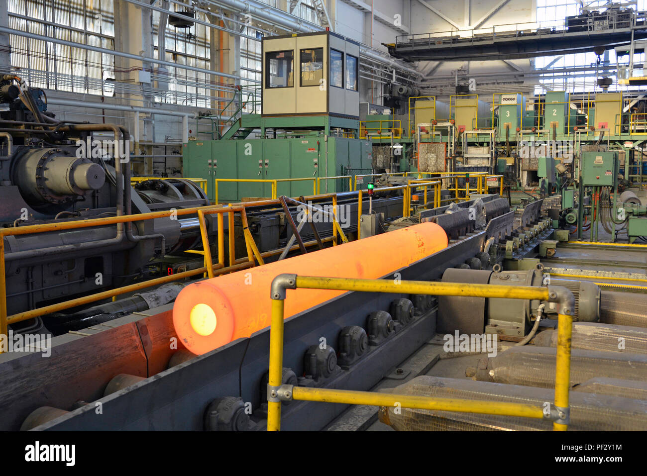 A 155mm howitzer tube is leaving an arsenal furnace where it was heated ...
