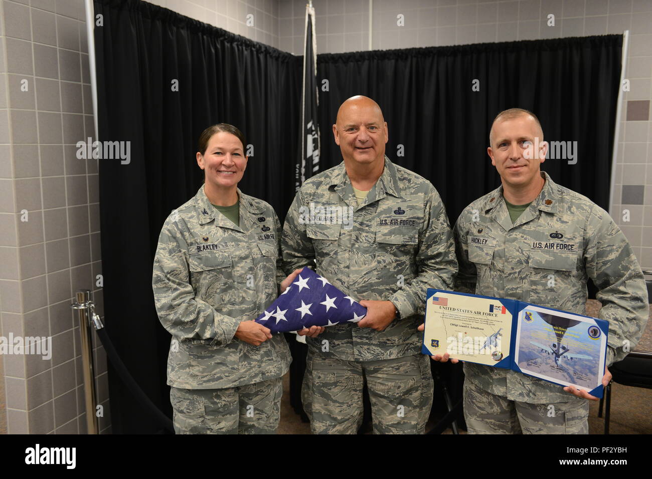 Command Chief Master Sergeant Ed Schellhase (center) receives an ...