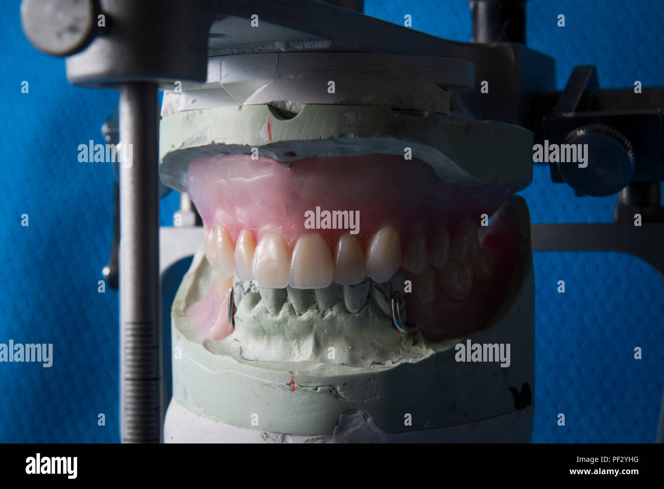 Uncompleted dentures sit in a vise to be worked on by the 374th Dental ...