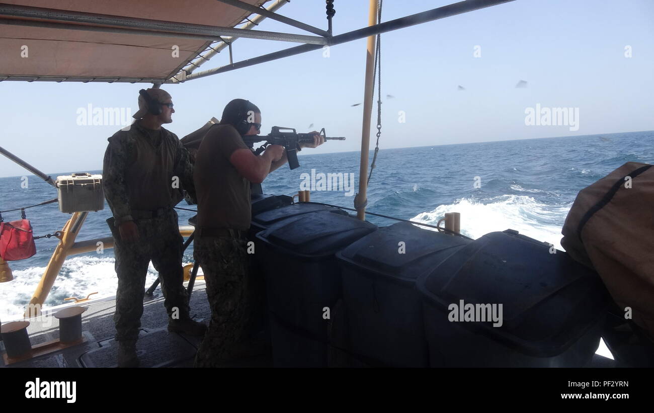 180619-N-NO146-0001 ARABIAN GULF (June 19, 2018) Coastguardsmen fire an ...