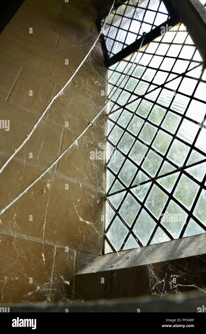 Window with cobwebs in St Lawrence's Church, Snarford, Lincolnshire, UK ...