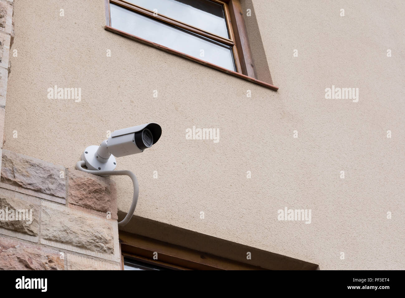security CCTV camera on the concrete wall with copy space Stock Photo ...