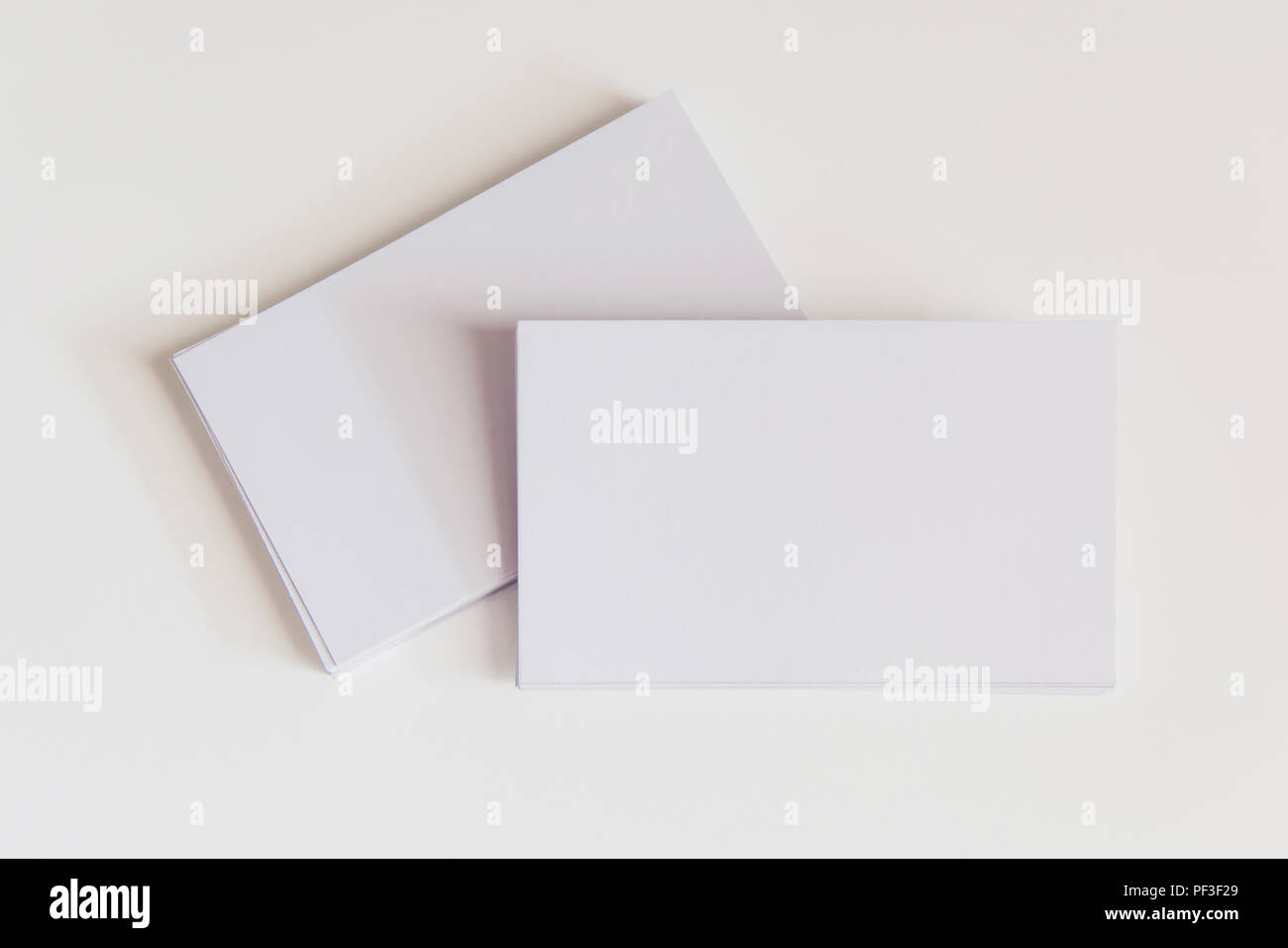 Stack of blank white business cards. Mockup business cards on white ...