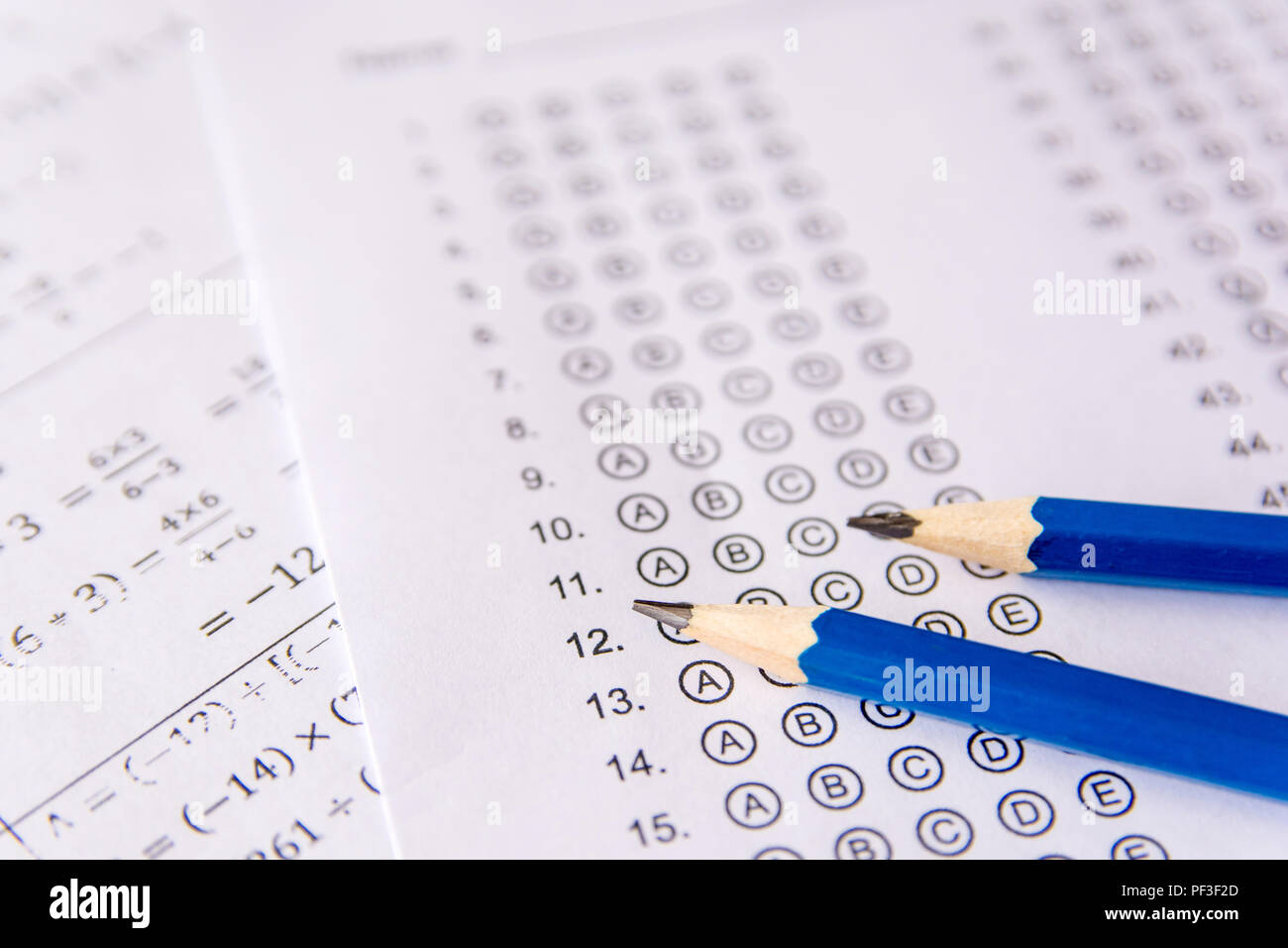 Pencil on answer sheets or Standardized test form with answers bubbled ...