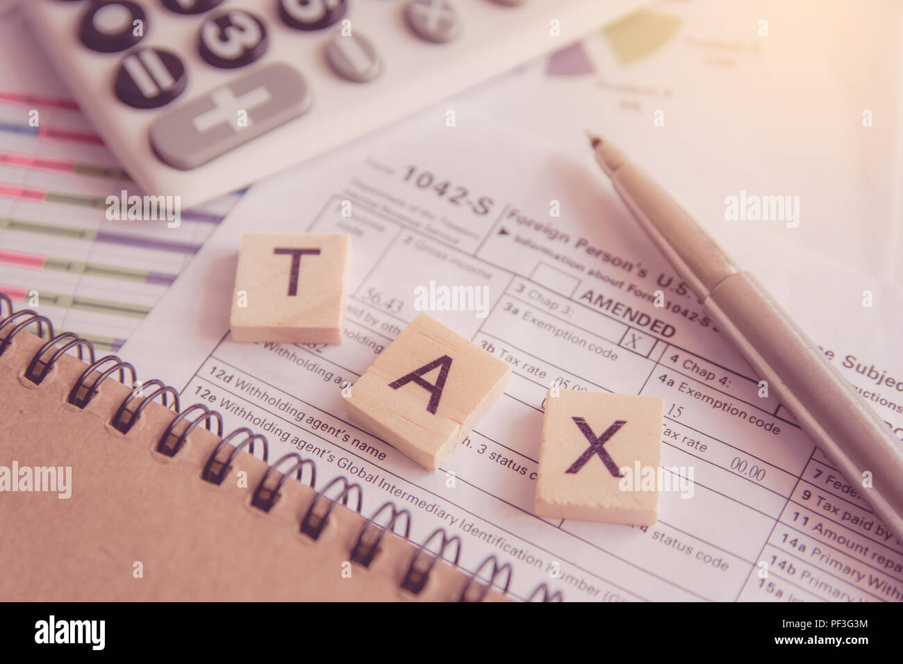 Alphabet letter wooden blocks tiles Tax text wooden block with on U.S ...