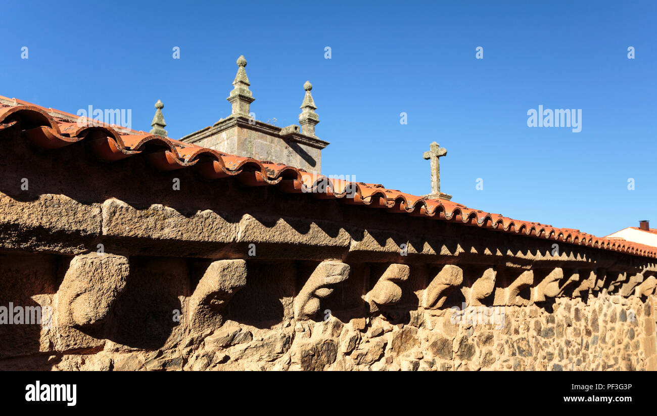 View of the Romanesque cornice corbels (cachorrada) with humans ...