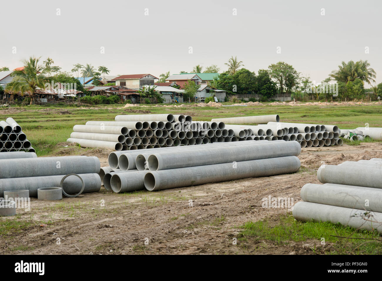 stacked of concrete, cement pipes. concrete pipes for irrigation at ...