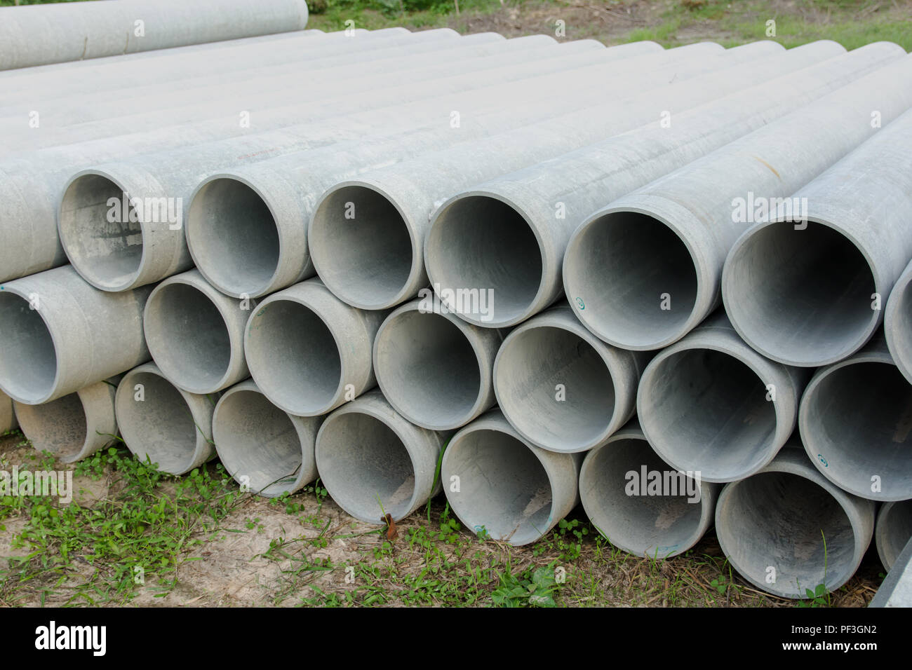 stacked of concrete, cement pipes. concrete pipes for irrigation at ...