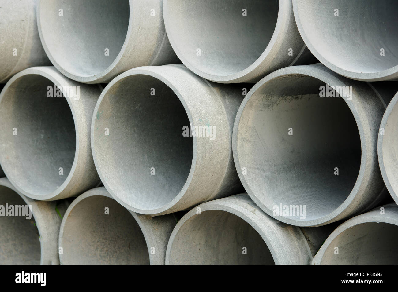 Close up concrete, cement pipes stacking, pattern background. concrete ...