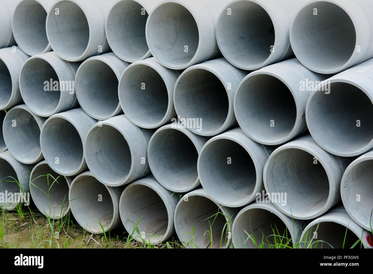 Close up concrete, cement pipes stacking, pattern background. concrete ...