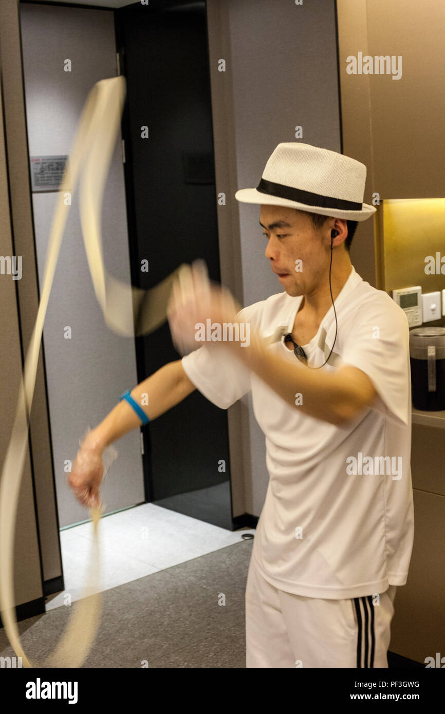 Nanjing, Jiangsu, China. "Noodle Dancing" Demonstration, Haidilao ...