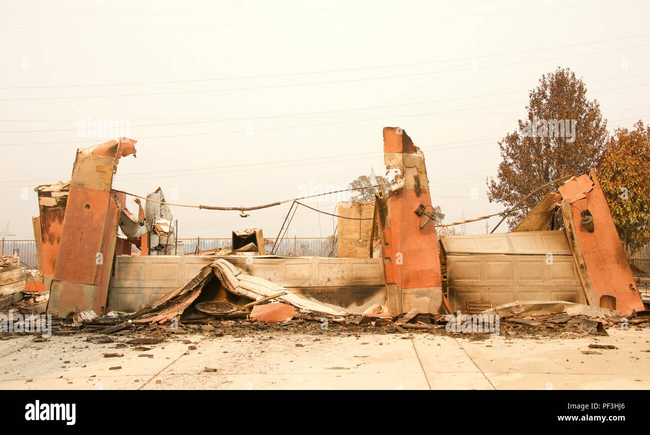 home burned to the ground, garage door buckled and laying in a heap ...