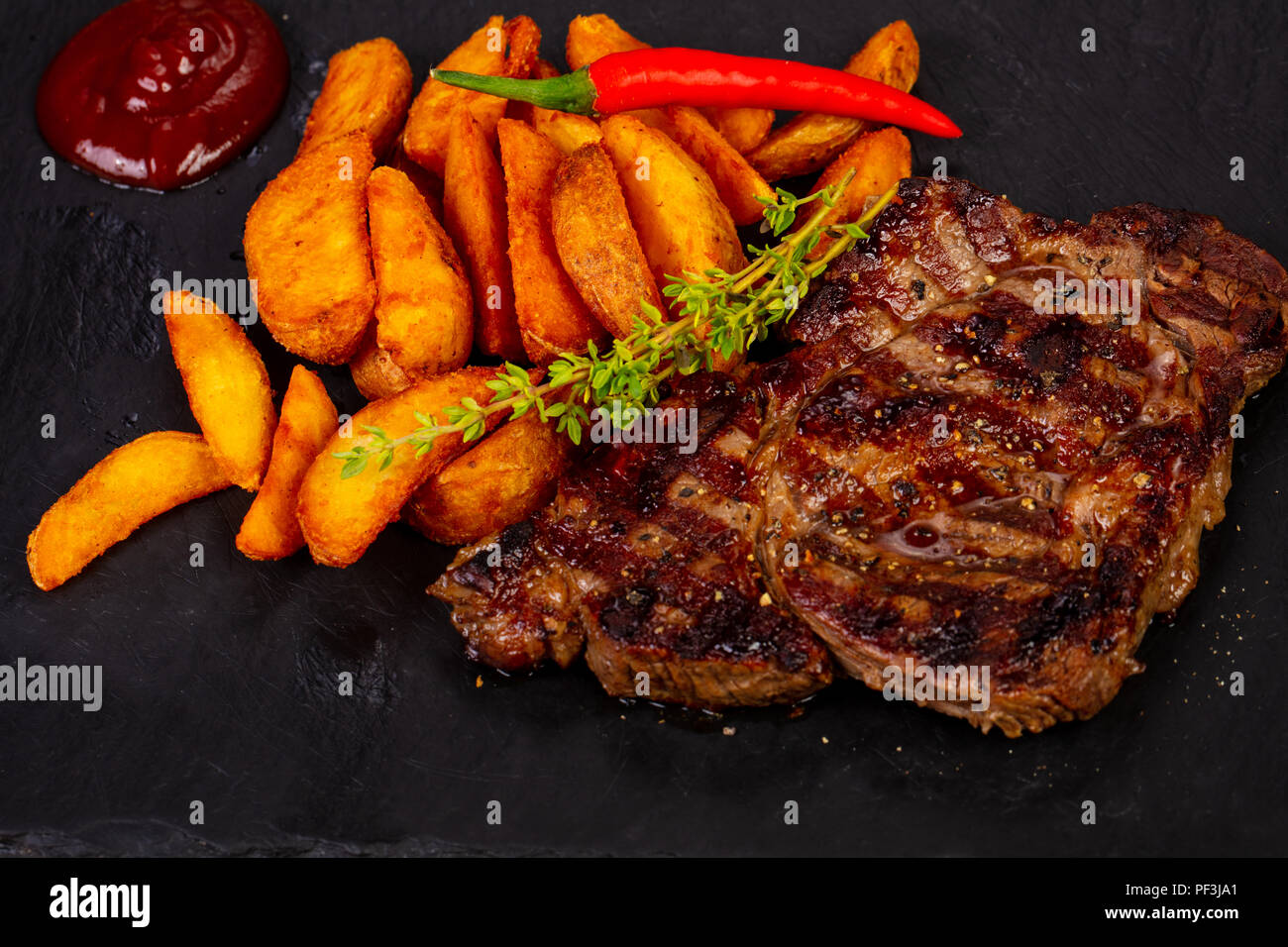 Grilled Beef steak with fried potato Stock Photo - Alamy