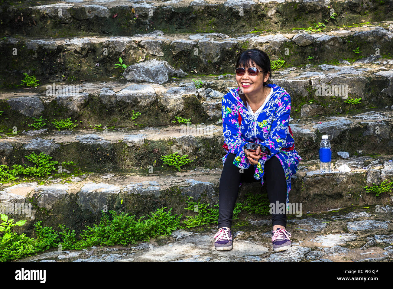 Tour guide, Asian lady at Mua Cave Steps Overlook Stock Photo - Alamy