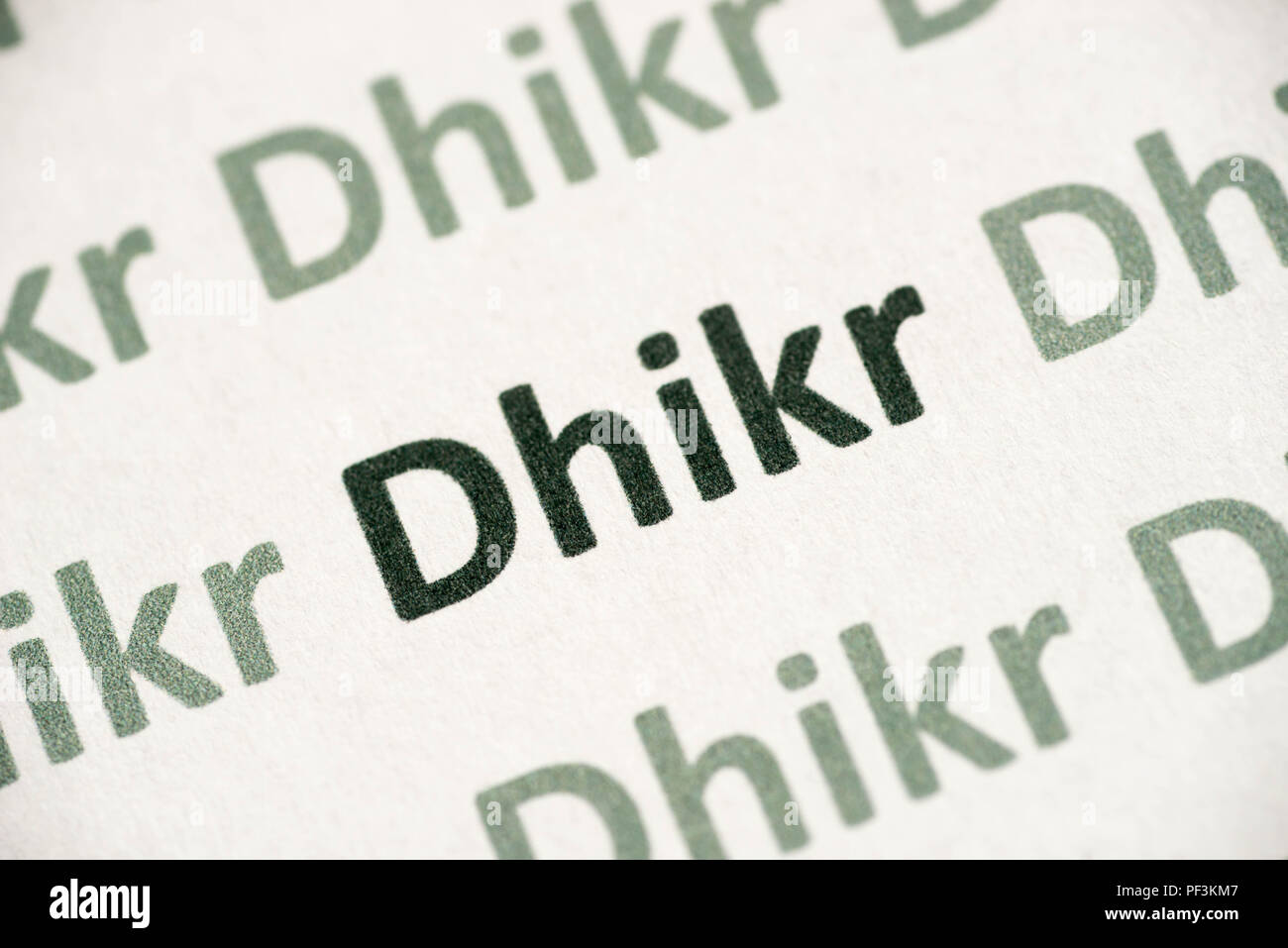 word Dhikr printed on white paper macro Stock Photo - Alamy
