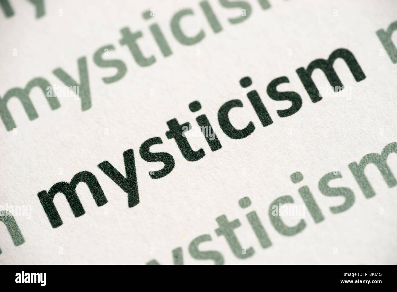 word mysticism printed on white paper macro Stock Photo - Alamy