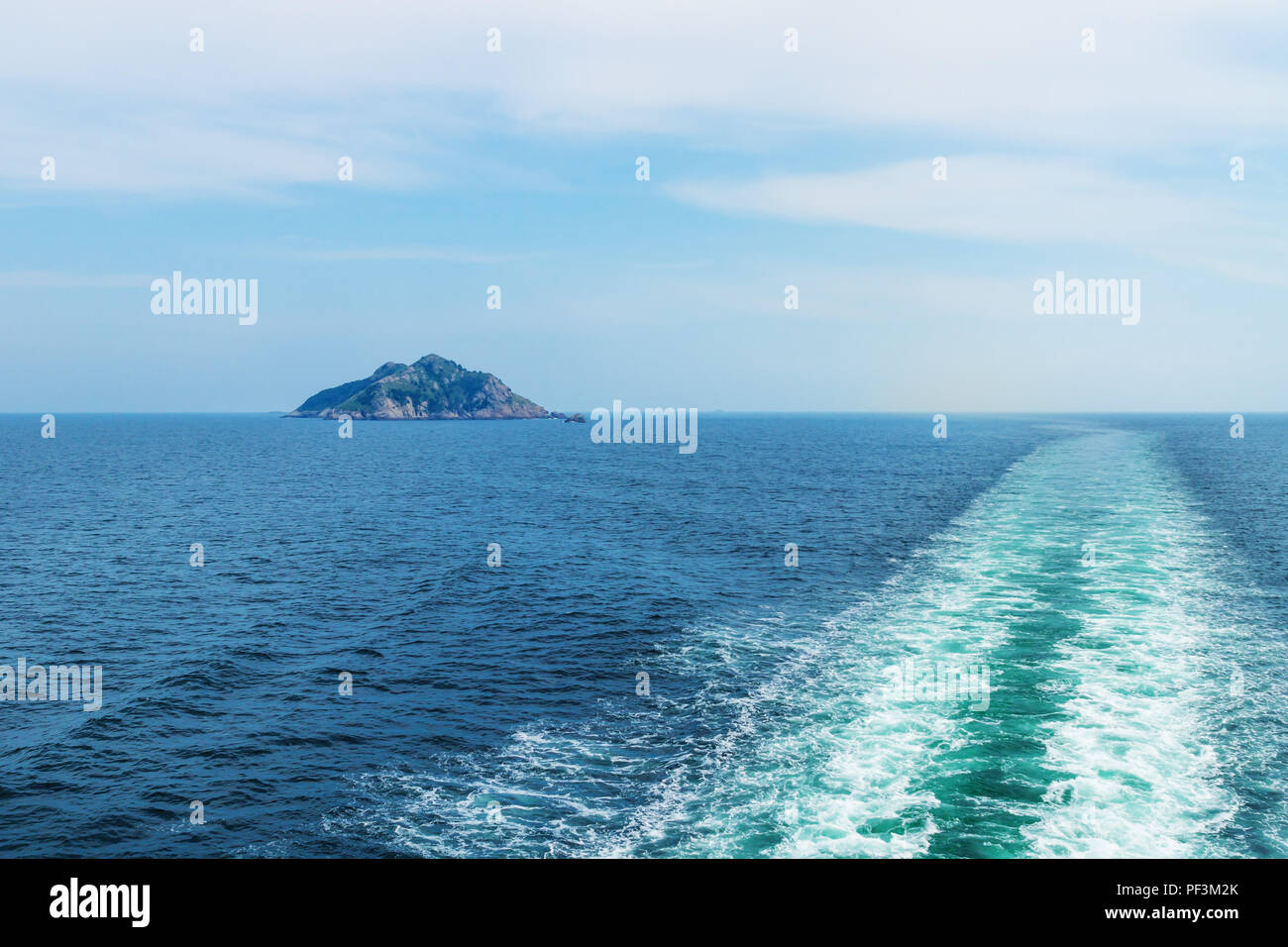 Boat trail waves in the ocean from the ferry from the way from Jeju ...