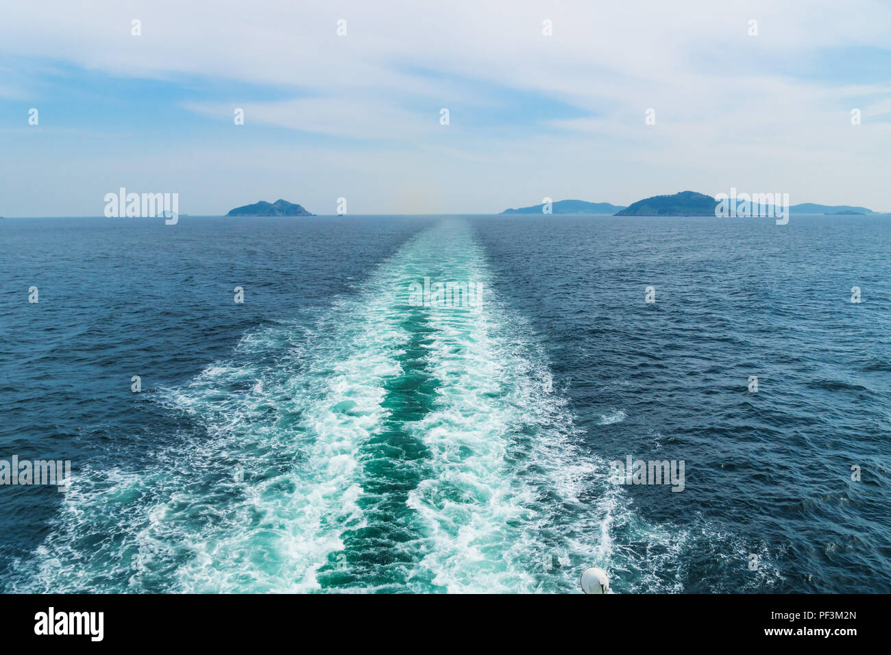 Boat trail waves in the ocean from the ferry from the way from Jeju ...
