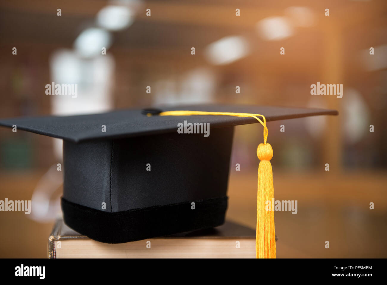 Blue graduation hat yellow tassel hi-res stock photography and images ...