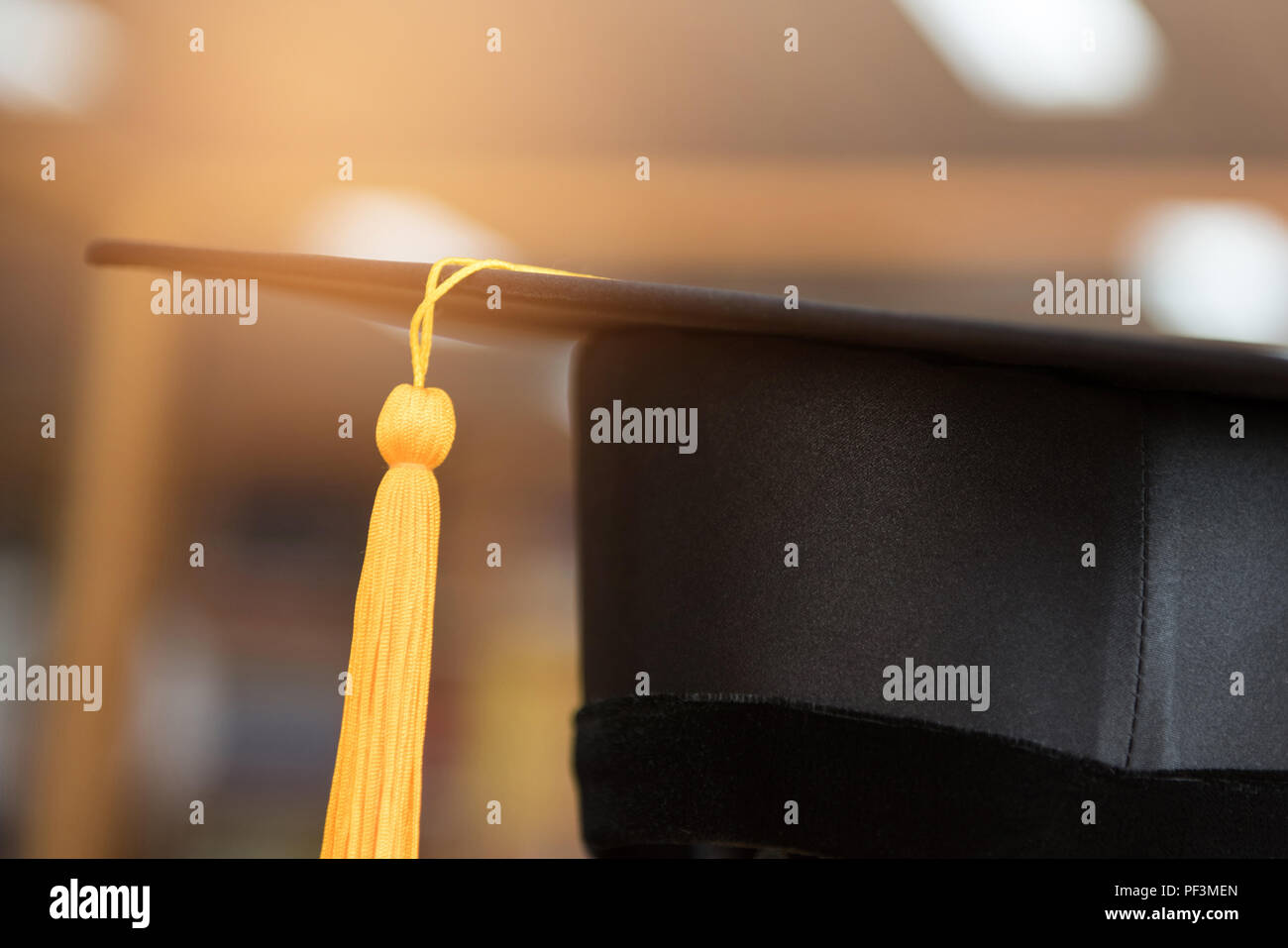 Blue graduation hat yellow tassel hi-res stock photography and images ...