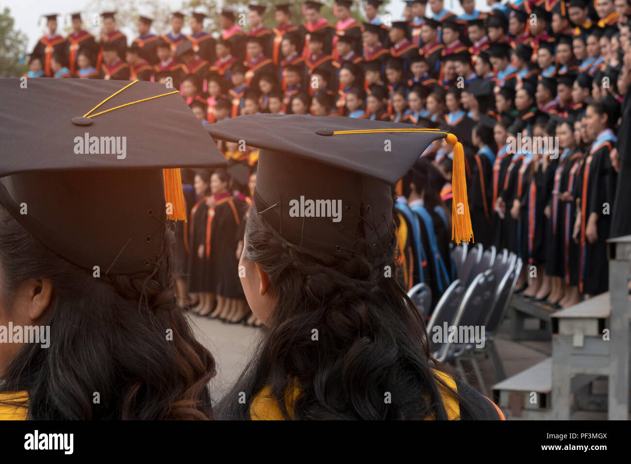 Back of graduation with black yellow tail cap at ceremony in graduation ...