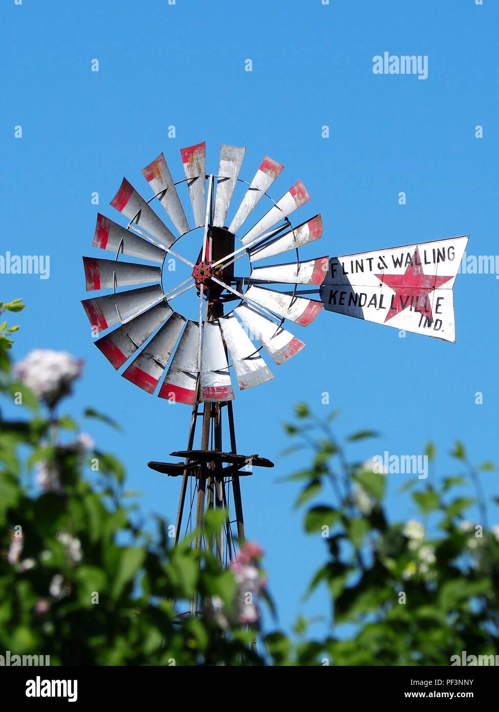 Vintage windmill supplying rural farm with renewable energy Stock Photo ...