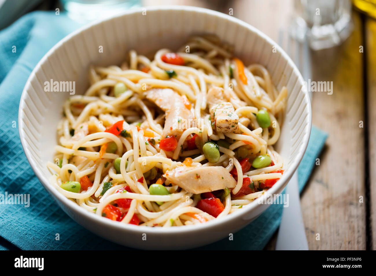 Sweet chilli chicken pasta salad with edamame and red peppers Stock ...