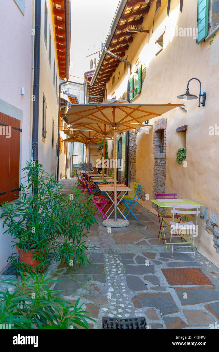 Small caffee, restaurant in narrow street in a medieval town with ...