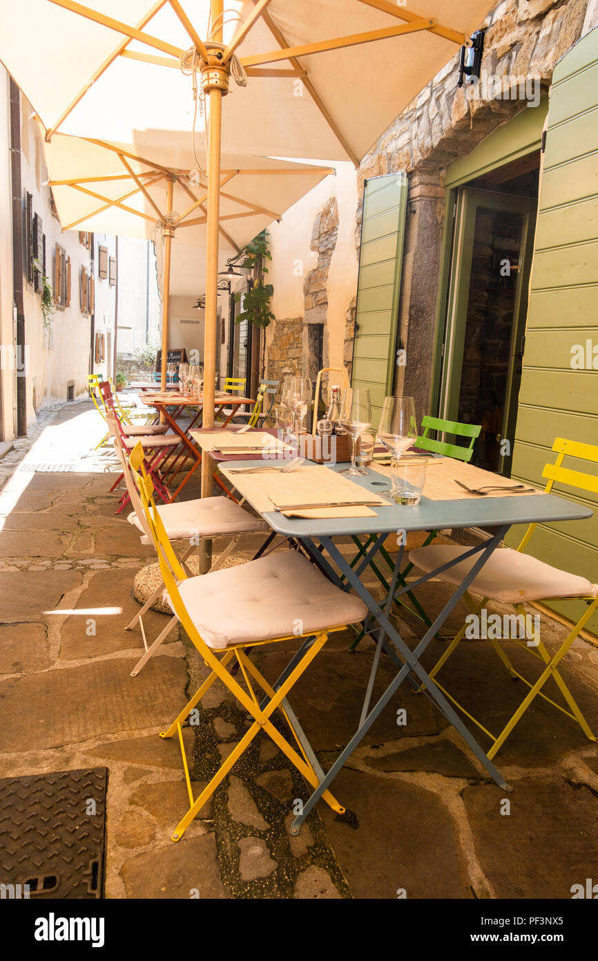 Small caffee, restaurant in narrow street in a medieval town with ...
