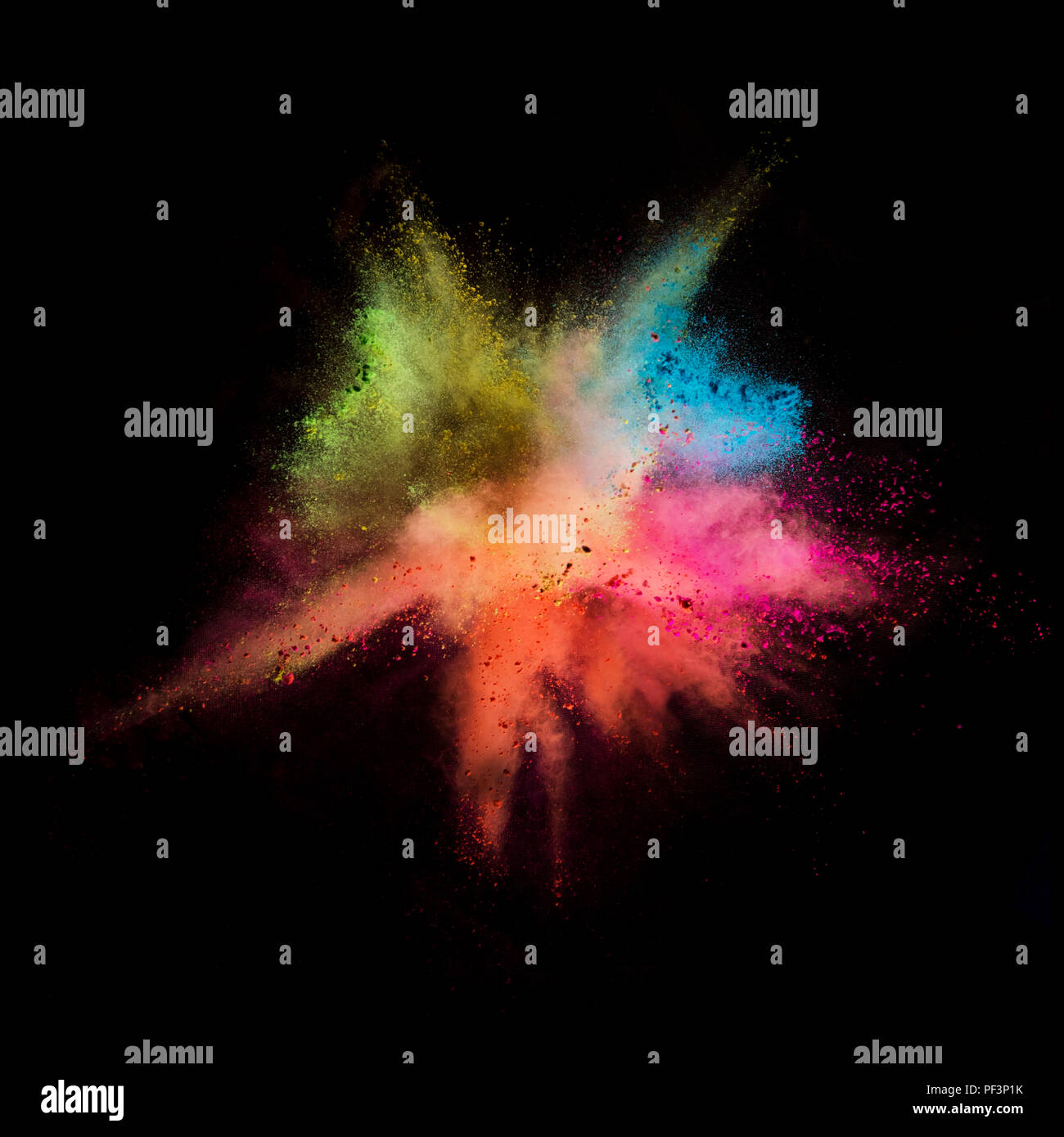 Explosion of coloured powder isolated on black background. Abstract ...
