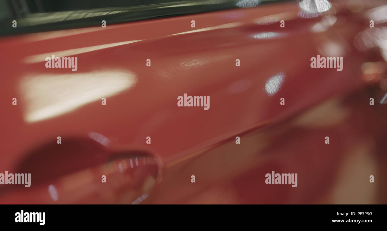 closeup of applied ceramic coating on the red car, wide photo Stock ...