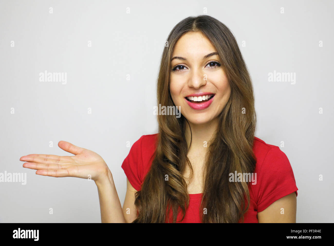 Beautiful woman showing your product on white background. Happy woman ...