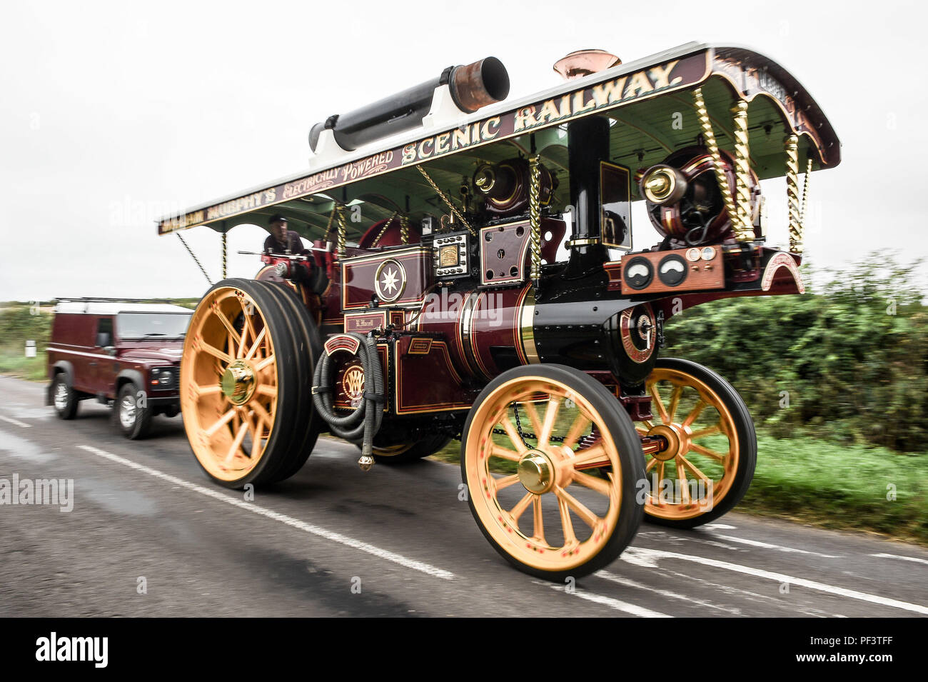 A Burrell Showmans Road Locomotive tows a Land Rover as dozens of steam ...