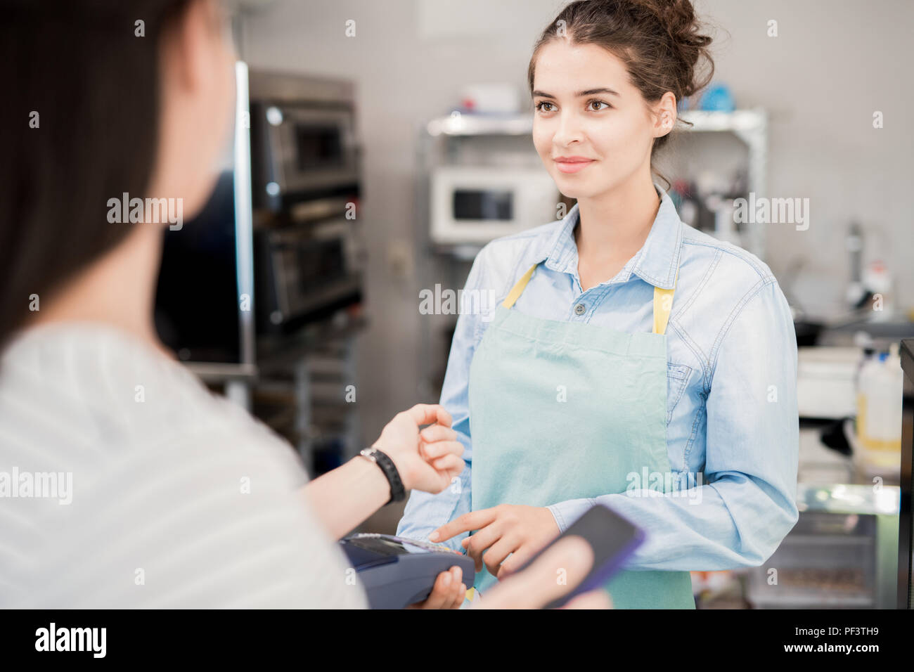 Shopkeeper Receiving Payment Stock Photo - Alamy