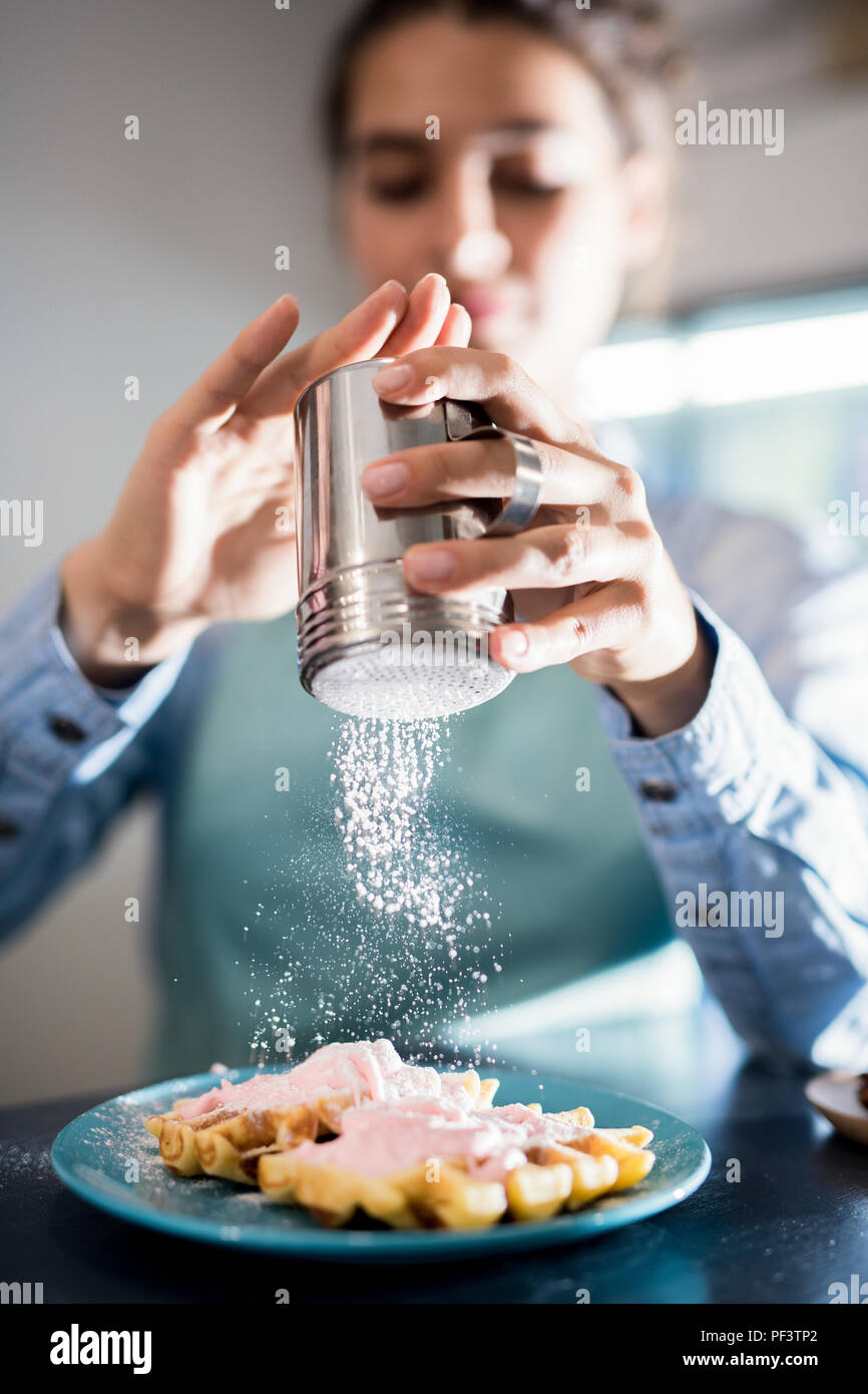Powdered Sugar Pouring over Sweet Waffles Stock Photo - Alamy