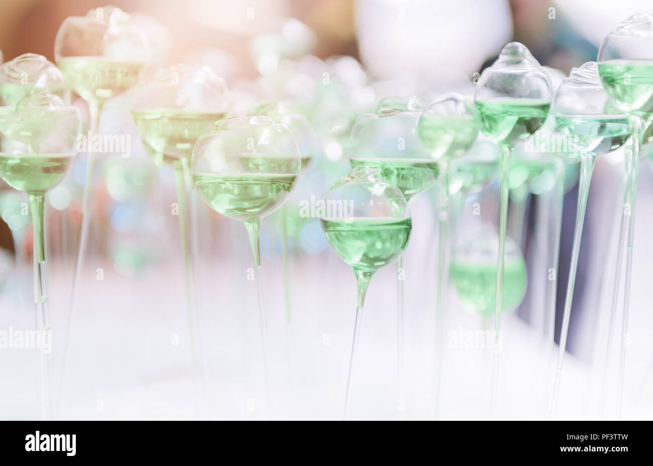 Green color water in glass tube, science background and selective focus ...