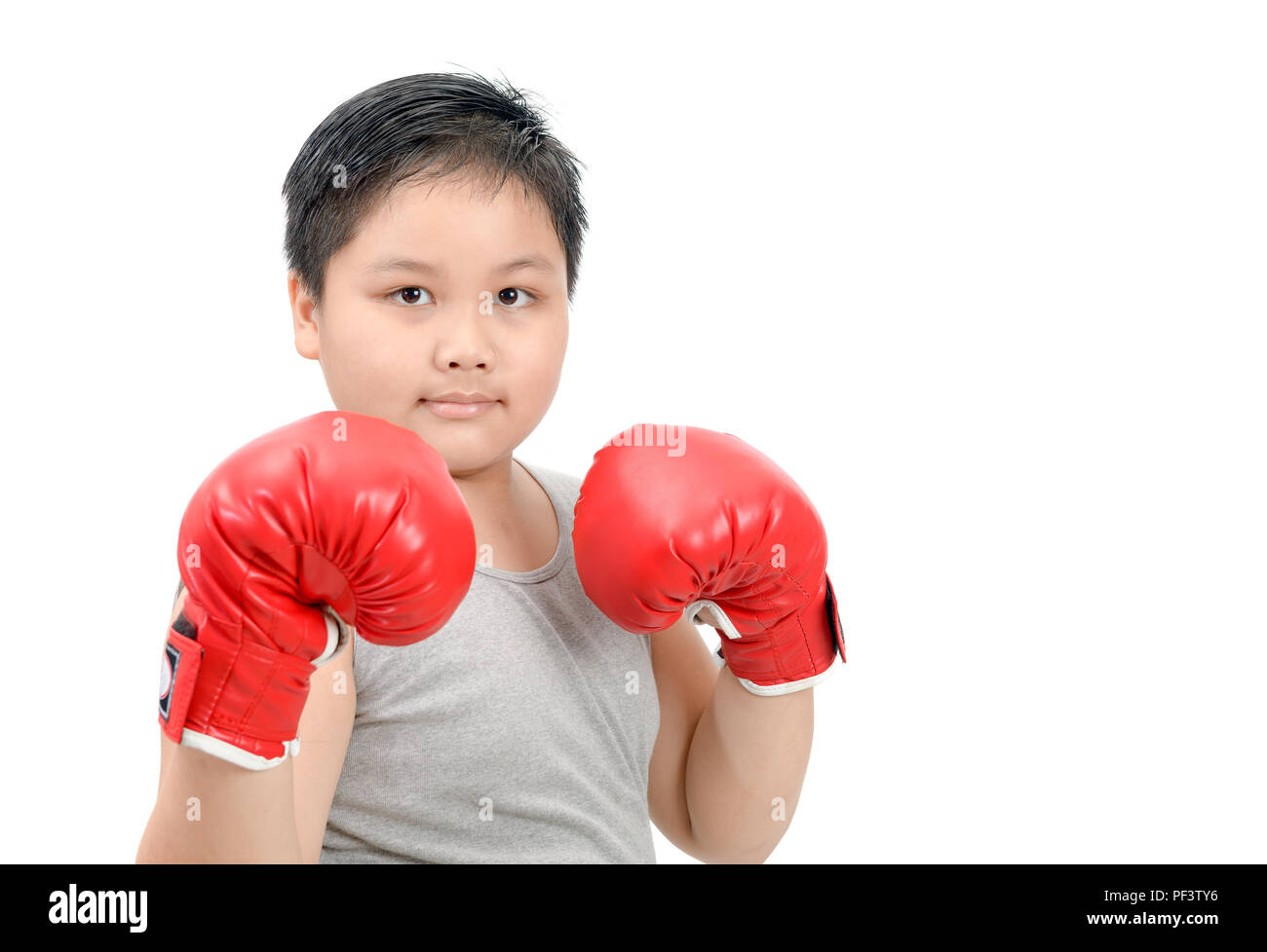 Obese fat boy kid fighting with red boxing gloves isolated on white ...