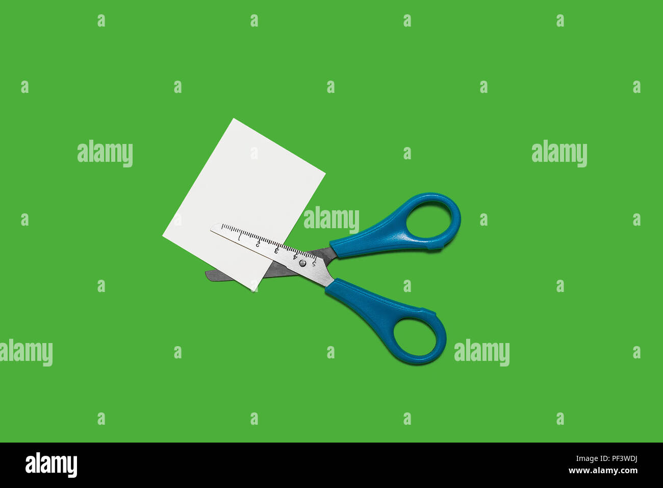 scissors cutting small paper Stock Photo - Alamy