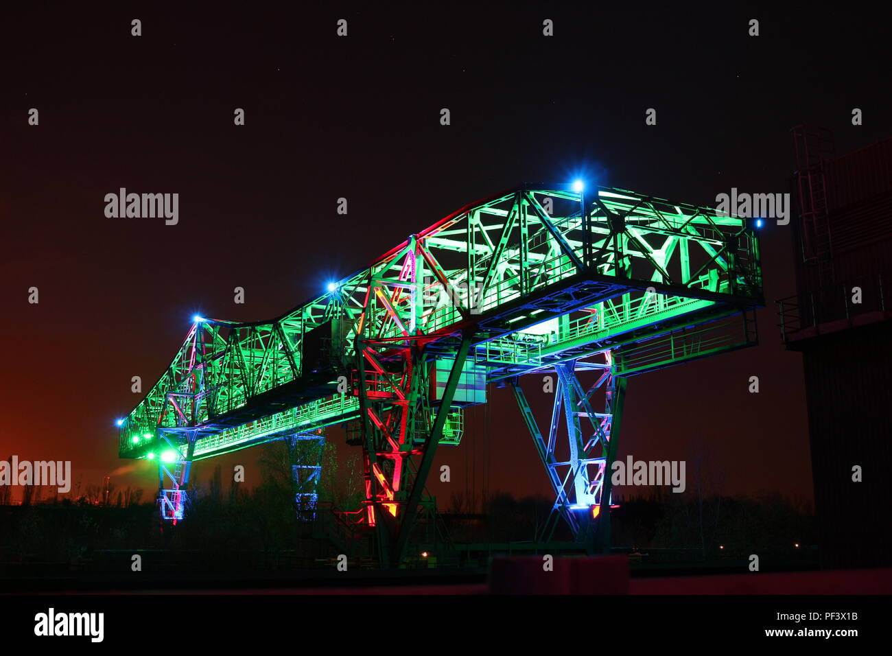 Old industry ore-bridge at night Stock Photo - Alamy