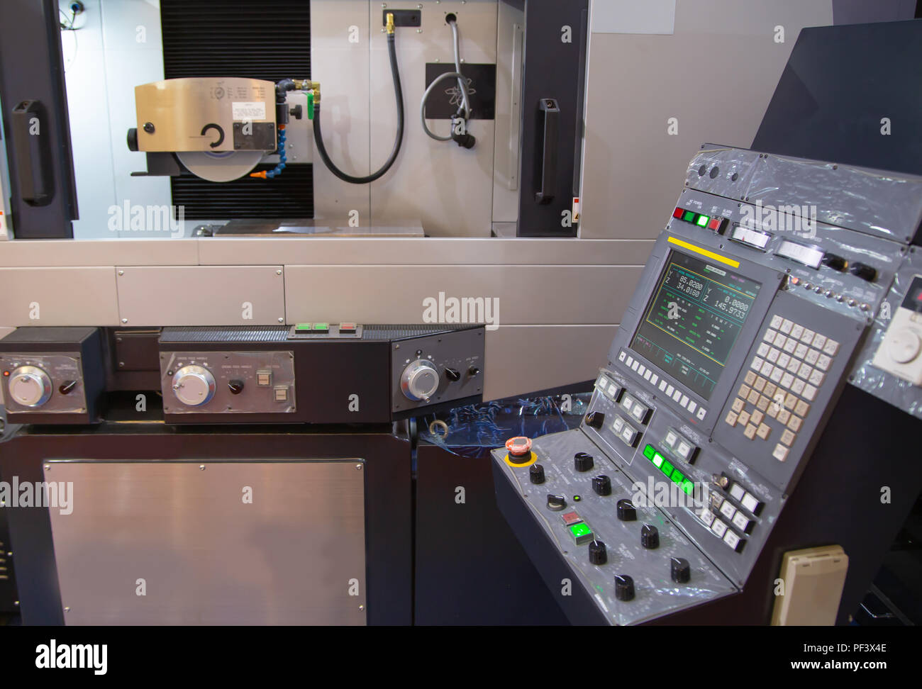 Fully automatic CNC hydraulic surface grinding machine Stock Photo - Alamy