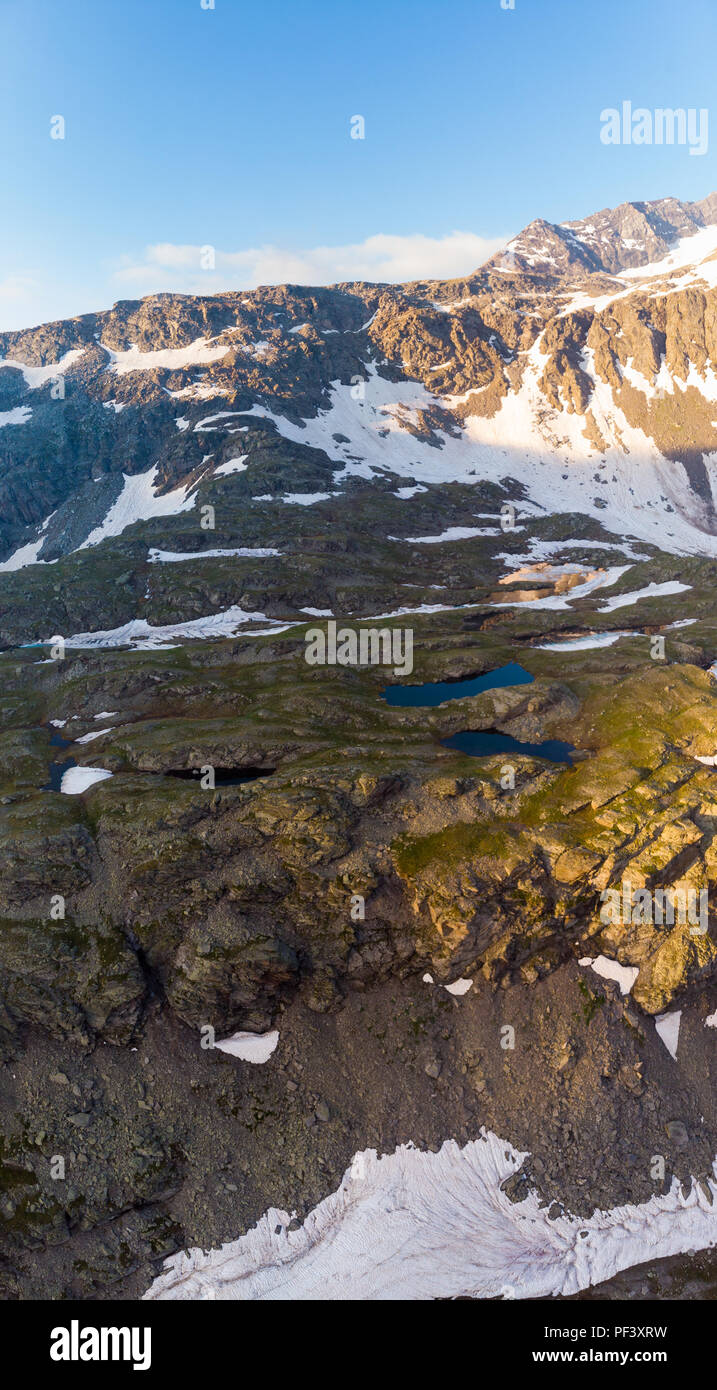 High altitude alpine landscape with majestic rocky mountain peaks ...