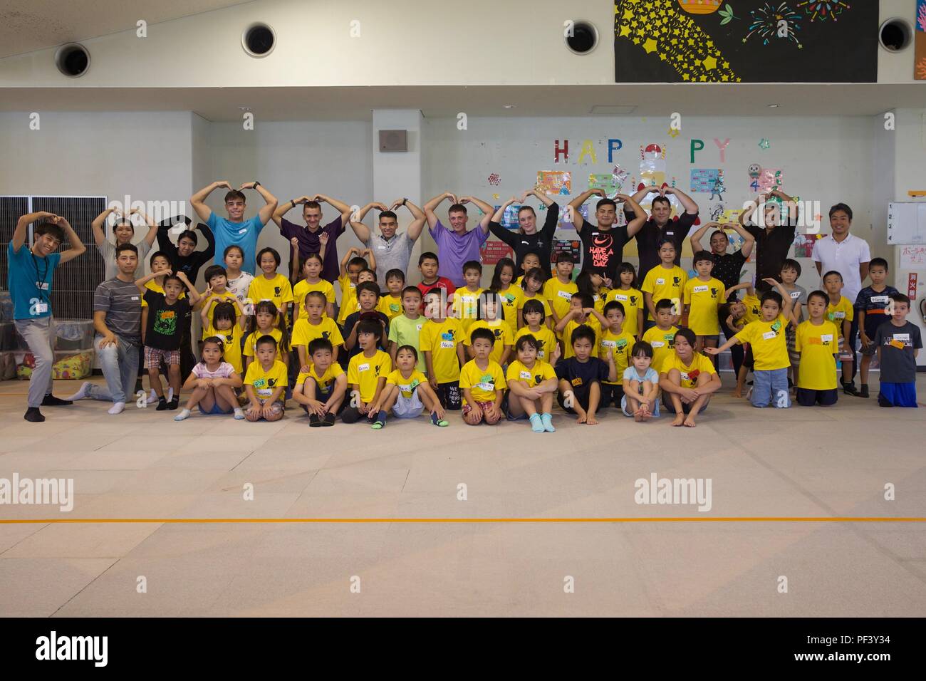 Marines, Okinawan children and employees of Kin District Daycare pose ...