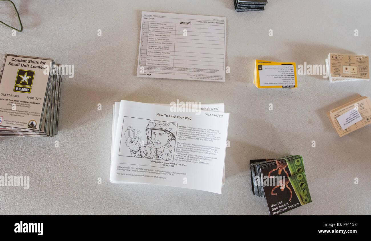 Several information booklets, cards, and pamphlets sit ready for any ...