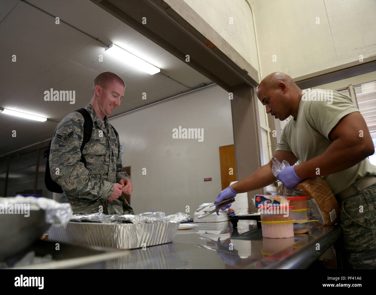 U.S. Air Force Mackenzie Airhart (left), a photojournalist assigned to ...