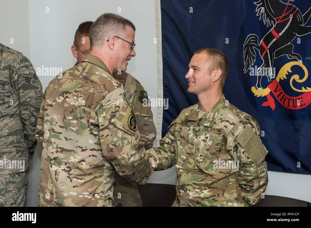 U.S. Air Force Chief Master Sgt. Gregory A. Smith (left), command chief ...